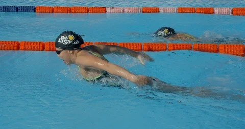Two women racing Butterfly swimming stro... | Stock Video | Pond5