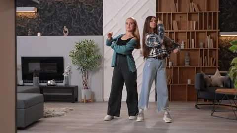 Two young beautiful women dancing hip ho... | Stock Video | Pond5