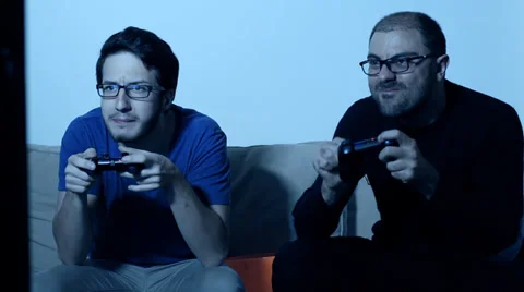 Two young gamers playing video games whi... | Stock Video | Pond5