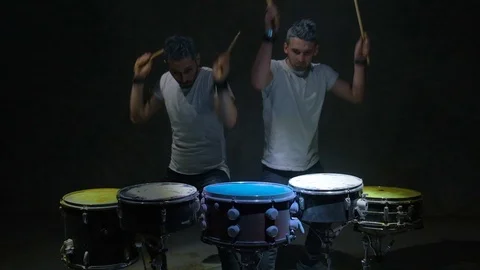 Two young men playing the drum. Colored ... | Stock Video | Pond5