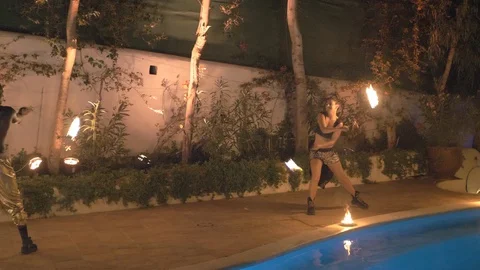 Two young people performing in a fire sh... | Stock Video | Pond5