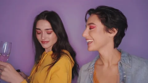 Two young women having fun drinking cham... | Stock Video | Pond5