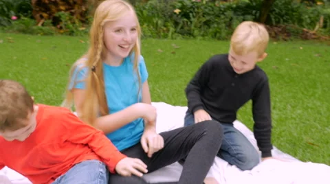 Two younger brothers pick on their older... | Stock Video | Pond5