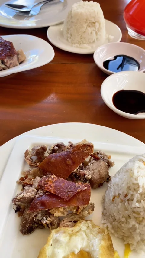 typical philippine food lechon fried suc... | Stock Video | Pond5