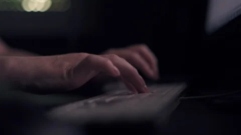 Typing computer keyboard in dark room | Stock Video | Pond5