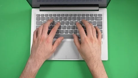 Typing on a Laptop Keyboard on a Green S... | Stock Video | Pond5
