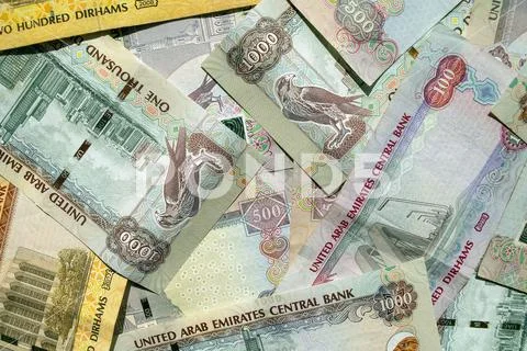 Photograph: UAE national currency, top view of mixed dirhams banknotes ...