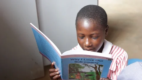 Ugandan school children reading books in... | Stock Video | Pond5