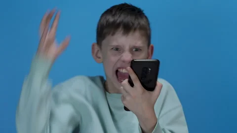 The ugly little guy is talking on the ph... | Stock Video | Pond5