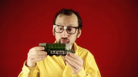 Ugly man model train play | Stock Video | Pond5
