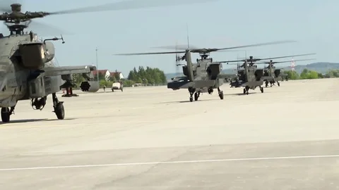 UH-64 Apache helicopters taxiing at Ille... | Stock Video | Pond5