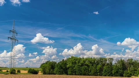 UHD. Time lapse of power lines pylons in... | Stock Video | Pond5