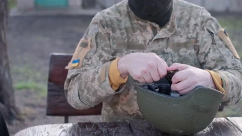 Ukrainian soldier loading ammunition int... | Stock Video | Pond5