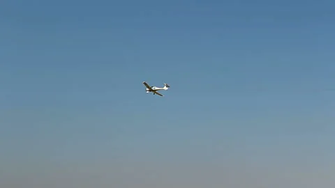 Ultra light, cessna plane drag on glider... | Stock Video | Pond5