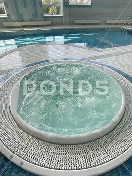 Unattended jacuzzi with blue water pool in the background. ~ Hi Res ...