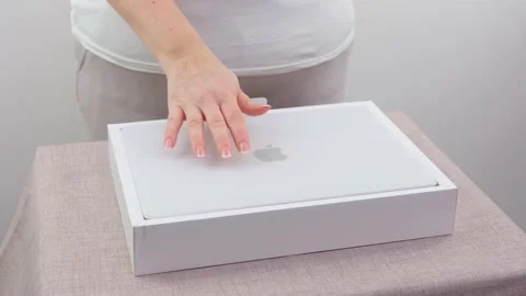 Unboxing of the new laptop model from Ap... | Stock Video | Pond5