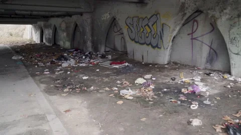 Uncollected garbage and trash under a br... | Stock Video | Pond5