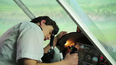Unconscious or dead pilot lying on steer... | Stock Video | Pond5