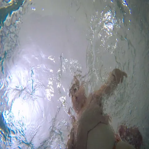 Under the water: the man bathing his son... | Stock Video | Pond5