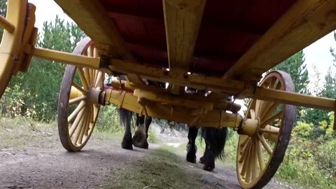 Undercarriage of wooden wagon and spoked... | Stock Video | Pond5