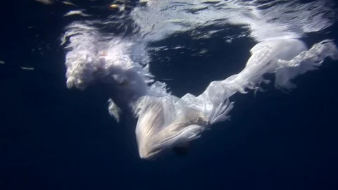 Underwater model in angel costume poses ... | Stock Video | Pond5