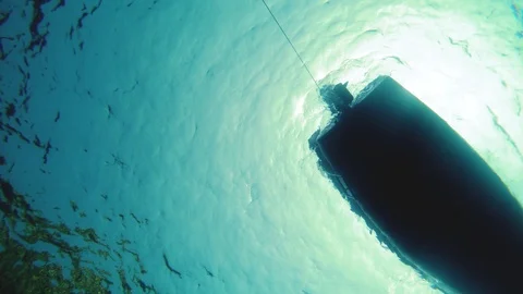 Underwater shot of bottom of boat floati... | Stock Video | Pond5
