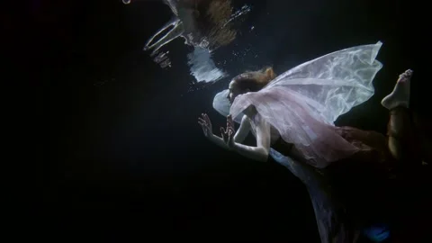 underwater view of a floating woman stre... | Stock Video | Pond5