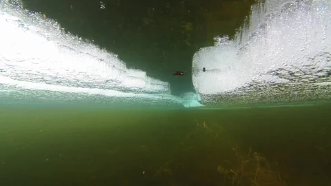 Underwater view of melting ice above wat... | Stock Video | Pond5