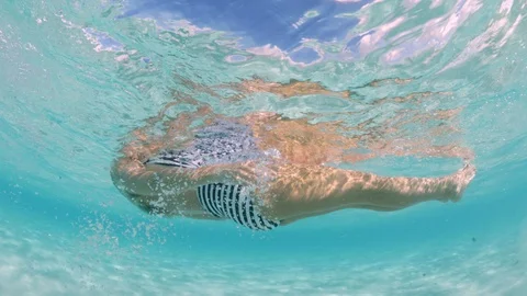 Underwater view of woman floating on bac... | Stock Video | Pond5