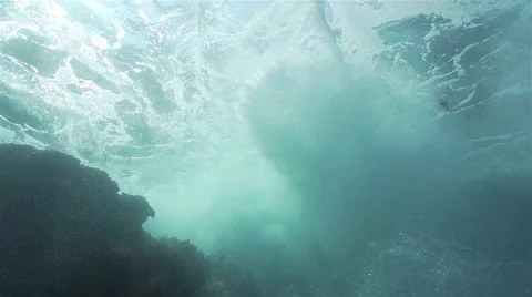 underwater wave breaks in the rock and f... | Stock Video | Pond5