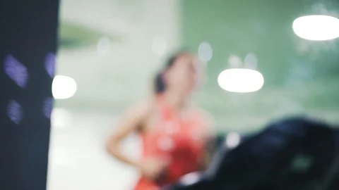 unfocused Girl athlete jogging on treadm... | Stock Video | Pond5