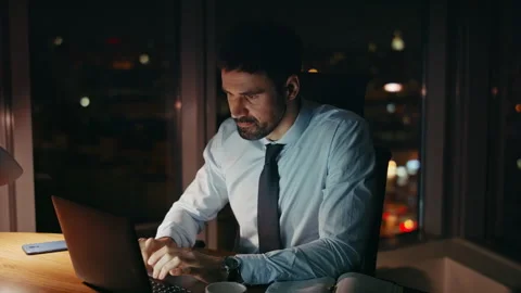 Unhappy manager sitting dark office look... | Stock Video | Pond5