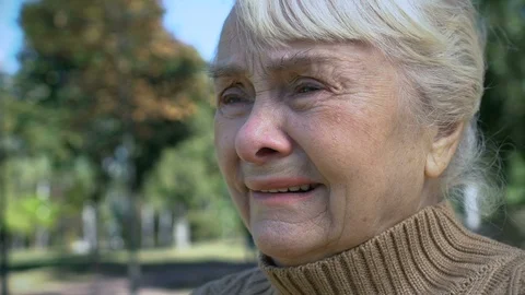 Unhappy retired lady crying outdoors, lo... | Stock Video | Pond5