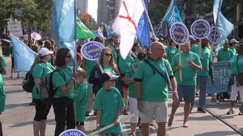 Union workers marching in solidarity for... | Stock Video | Pond5