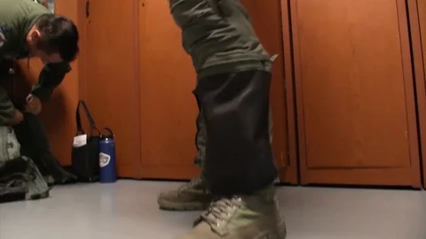 Unit members donning their uniforms and ... | Stock Video | Pond5