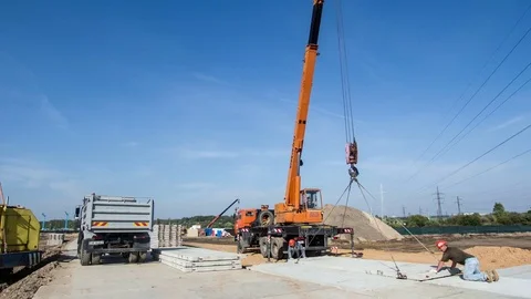 Unloading concrete slabs. Mount road. Co... | Stock Video | Pond5