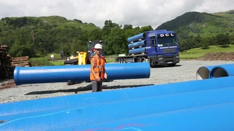 Unloading hydro pipes for the New Rydal ... | Stock Video | Pond5