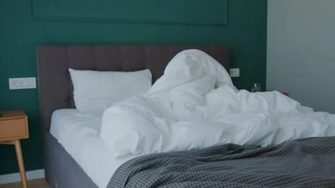 Unmade bed crumpled sheets bedroom. Tidy... | Stock Video | Pond5