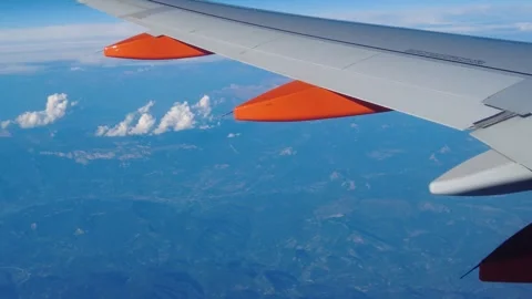 unmarked airplane's wing view while flyi... | Stock Video | Pond5