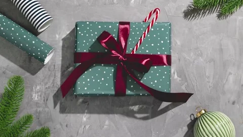 Unpacking of Christmas present with gree... | Stock Video | Pond5