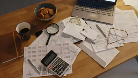 Unpaid Bills and Calculator on Table in ... | Stock Video | Pond5