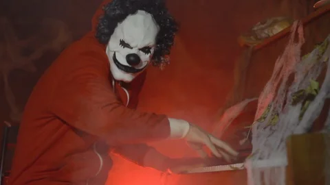 Unrecognisable man with scary clown hall... | Stock Video | Pond5