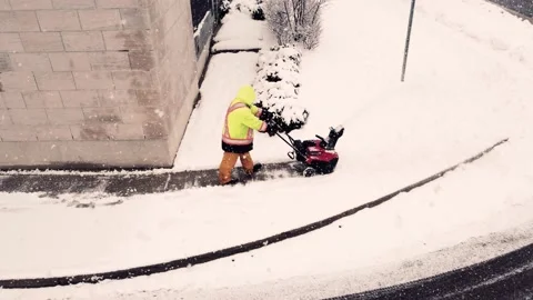 Unrecognisable operator using snowblower... | Stock Video | Pond5