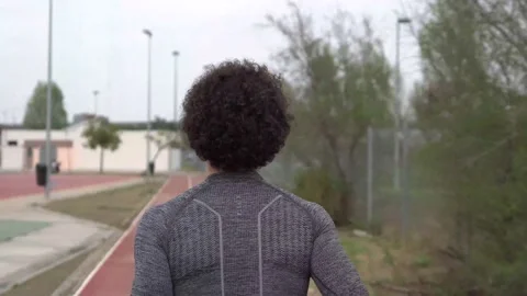 Unrecognizable curly Spanish man running... | Stock Video | Pond5