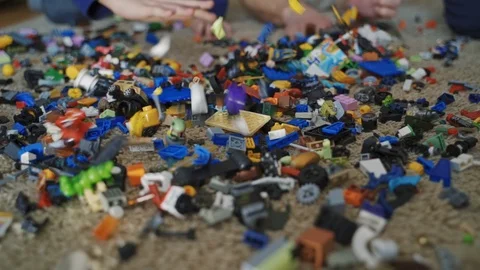 Unrecognizable hands throwing many lego ... | Stock Video | Pond5