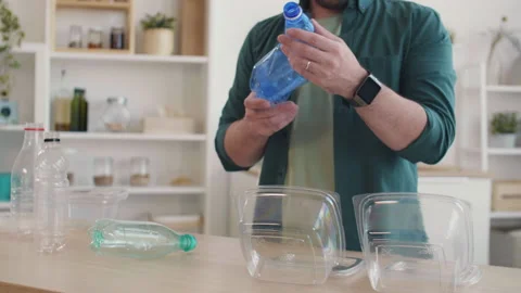 Unrecognizable Man Sorting Plastic Waste | Stock Video | Pond5