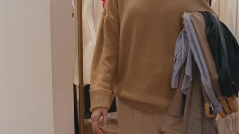 Unrecognizable Woman with Clothing Items... | Stock Video | Pond5