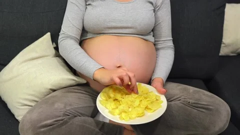 Unrecognizable woman eating unhealthy po... | Stock Video | Pond5