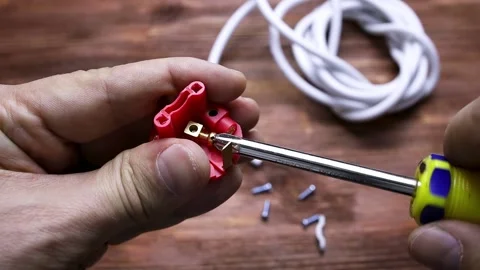unscrewing the screw from the clamp grou... | Stock Video | Pond5
