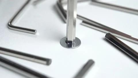 Unscrewing a screw with a hex wrench. Us... | Stock Video | Pond5